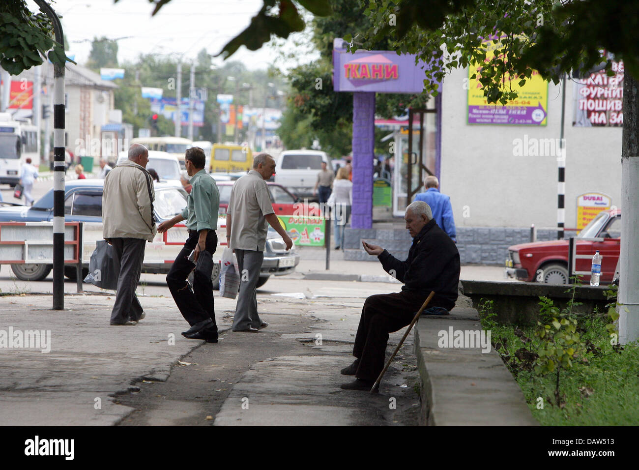 An old man begs for alms in the city center of Balti, Moldova, 30 ...