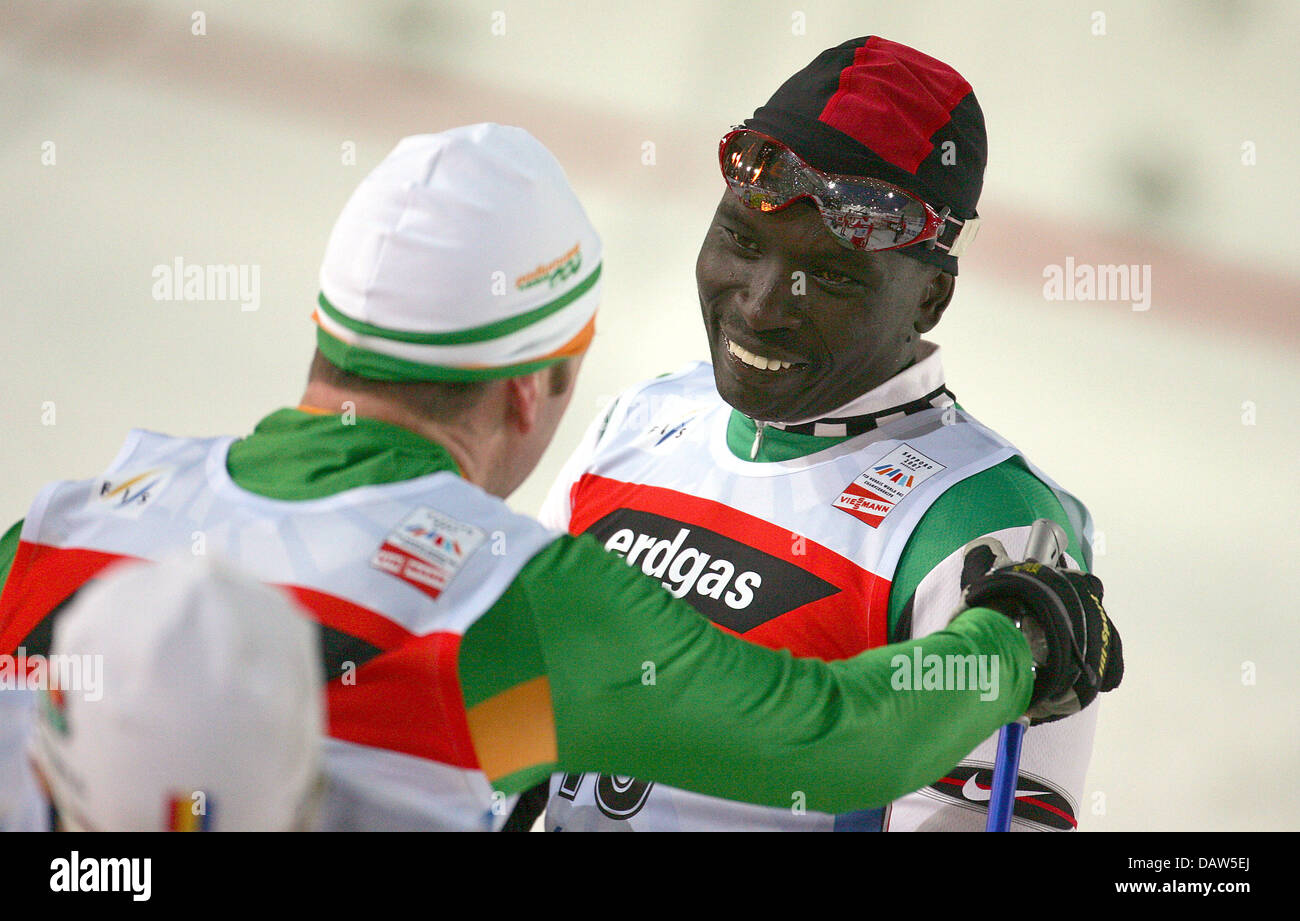 Brazilian Nordic combined athlete Helio Freitas (L) hugs Kenyan nordic ...
