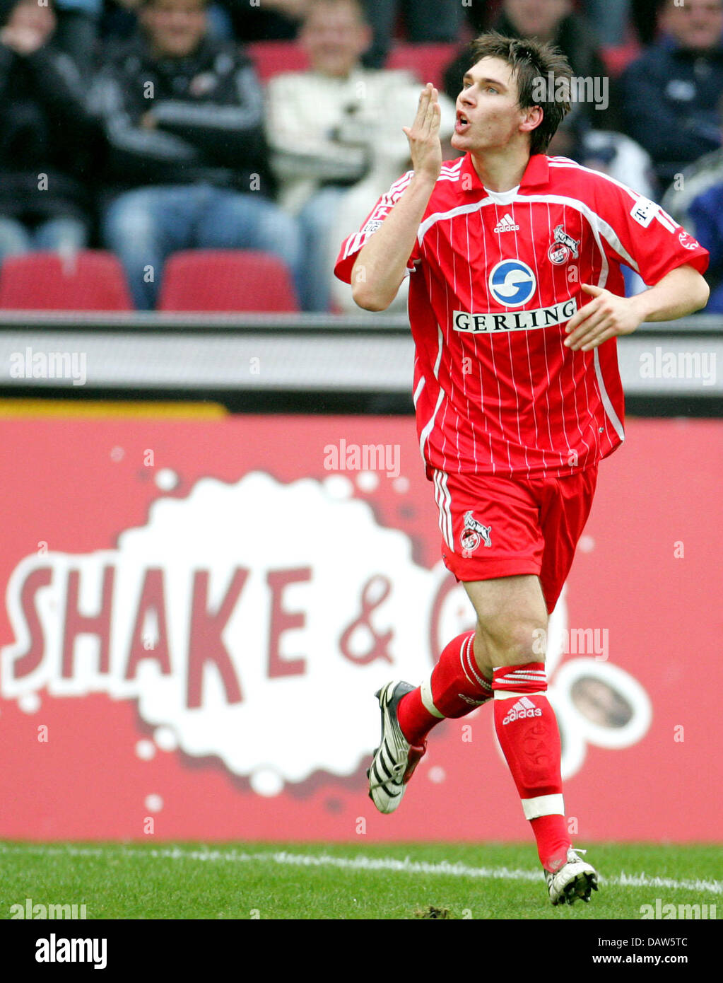 Cologne's Patrick Helmes makes a gesture after scoring the 1-1 during ...