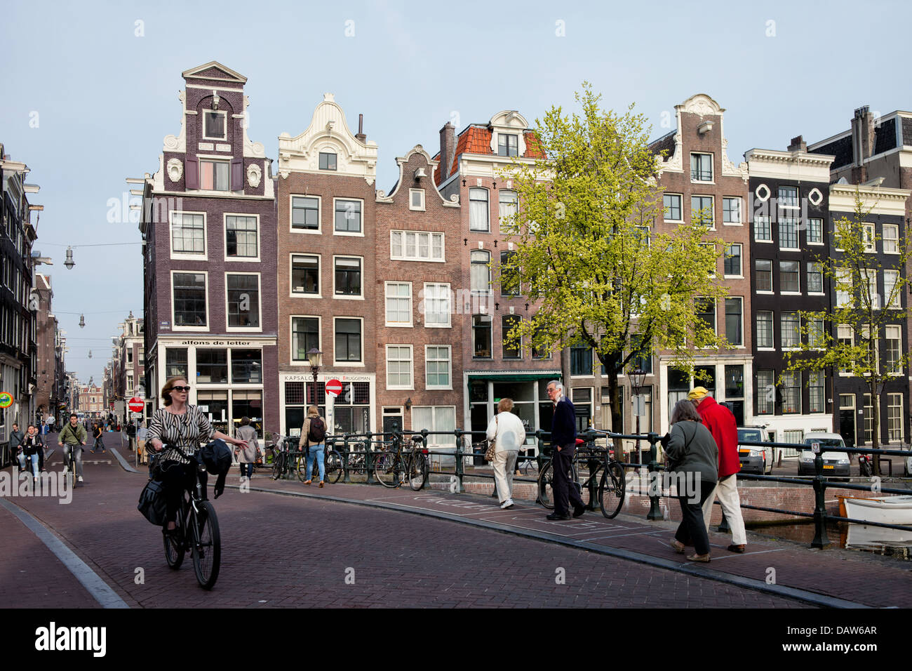 Amsterdam city life, traditional Dutch houses by the Singel canal ...