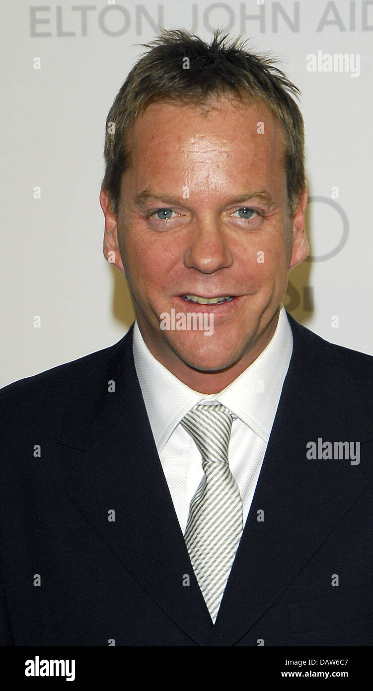 US actor Kiefer Sutherland smiles for the cameras arriving at the ...