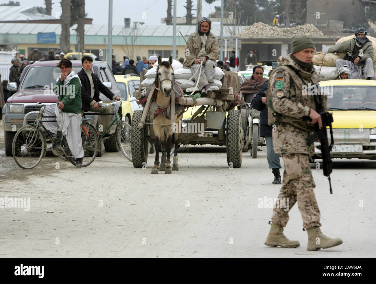 A German ISAF soldier patrols the busy streets of Mazar-i-Scharif in ...
