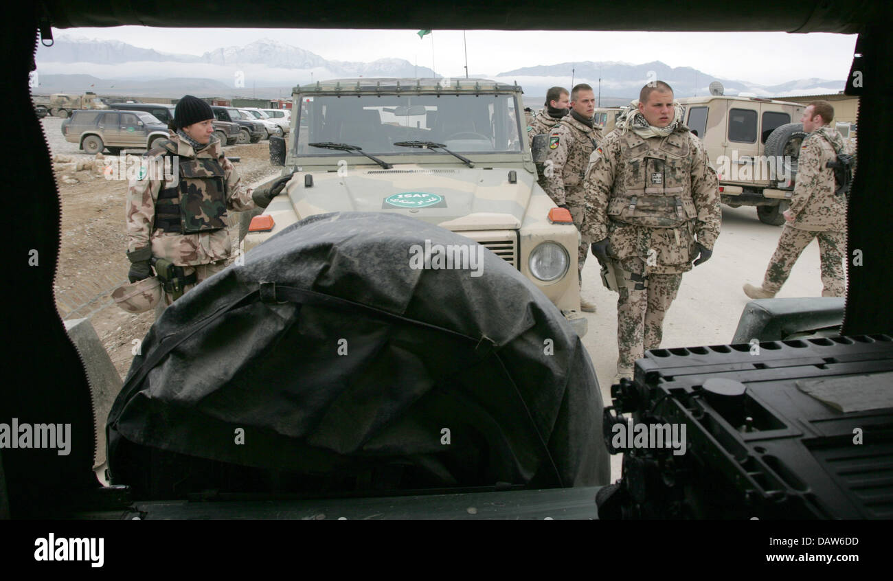 German ISAF soldiers photographed from a jeep at their camp in Mazar-i ...