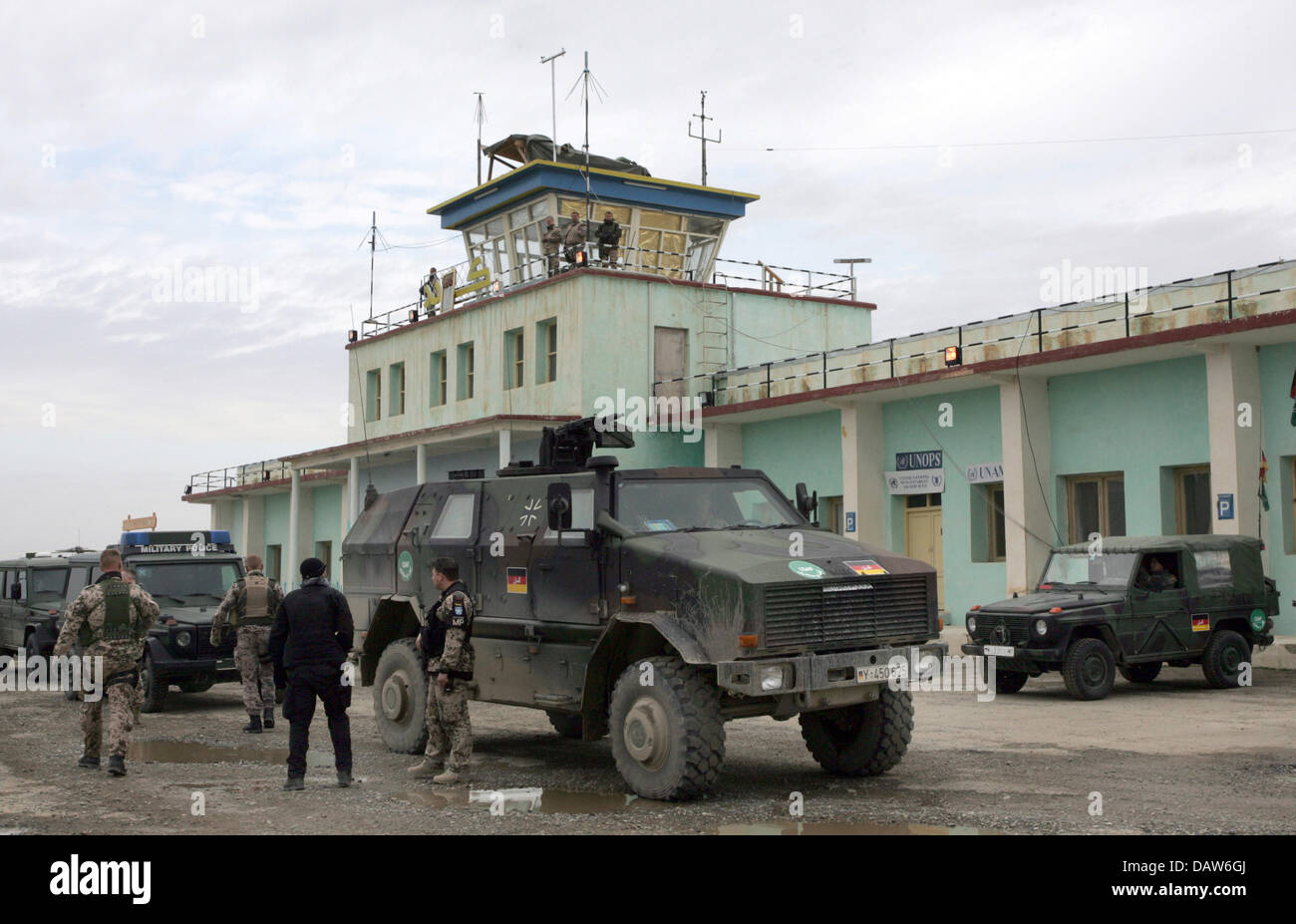 German ISAF contingent soldiers and jeeps shown at the airport in ...