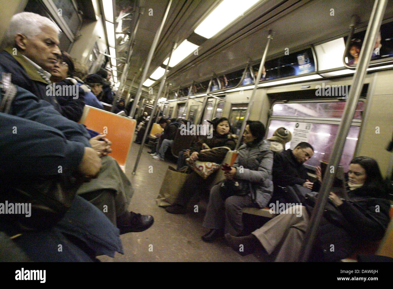 Many passengers sit in a subway train in New York City, United States ...