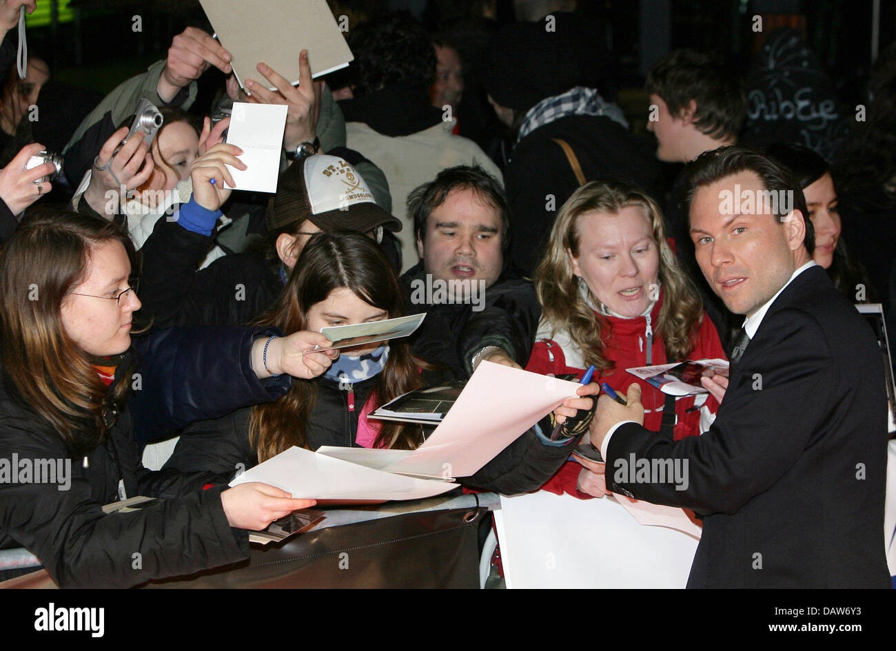 US actor Christian Slater (R) signs autographs at the German premiere ...