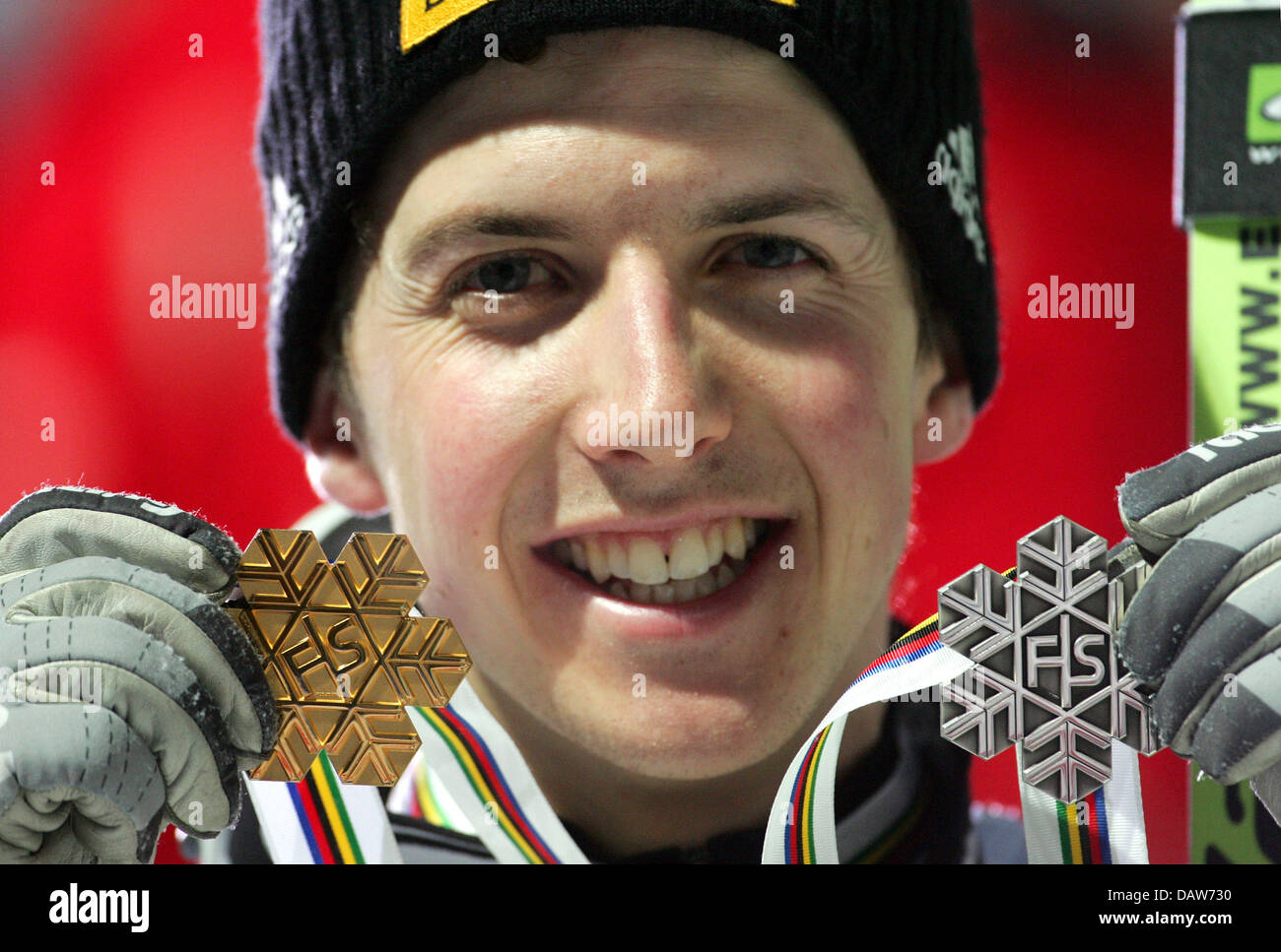 Swiss ski jumper Simon Ammann presents his medals he won at the ski ...