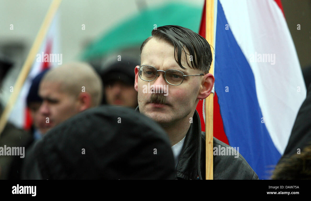 A neo-Nazi pictured in the rain at a rally in Halbe, Germany Stock ...