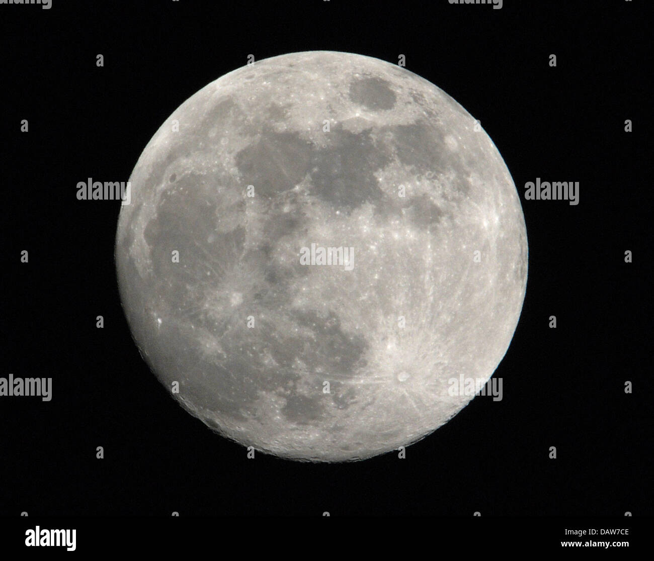 The moon is pictured prior to a total eclipse over Dietzenbach, Germany ...