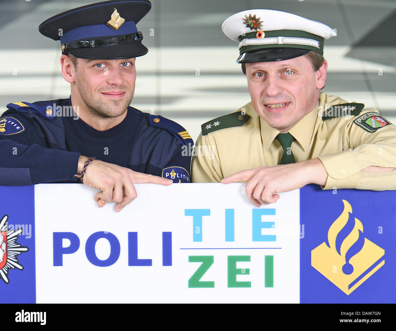 Dutch policeman Marco Slangen (L) and his German colleague Hans-Joachim ...