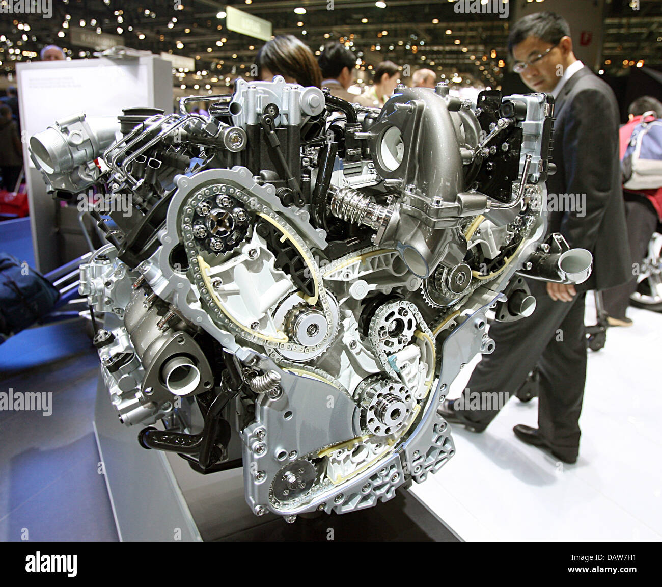 A visitor looks at a Audi V6 3,0 TDI engine at the Geneva Motor Show in ...