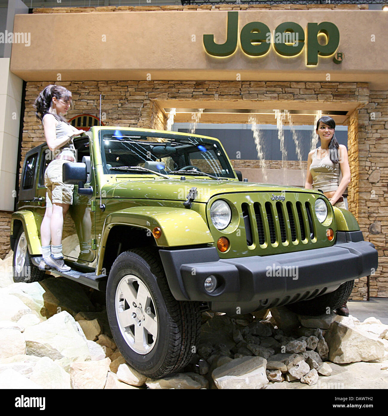 Models pose on a Jeep 'Jeep' at the Geneva Motor Show in Geneva ...