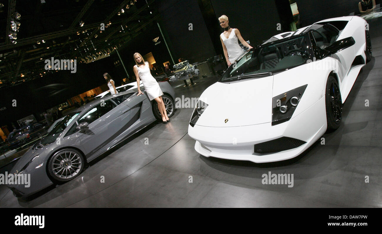 Two models pose with the new Gallardo (R) and the new Murcielago LP640 ...