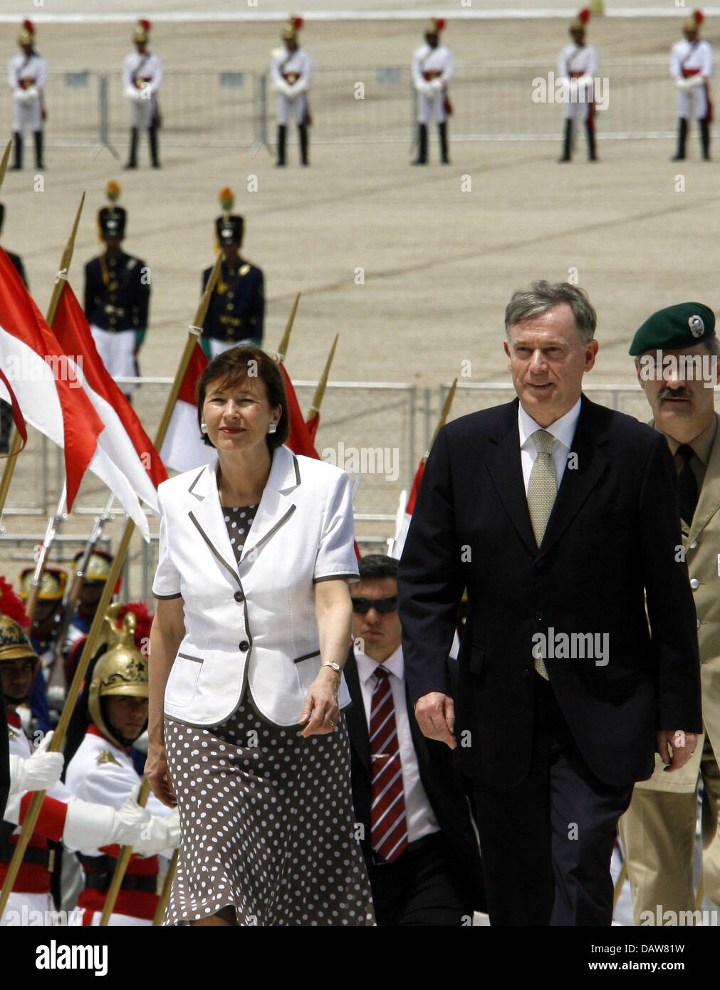 German President Horst Koehler and his wife Eva walk up the stairs ...