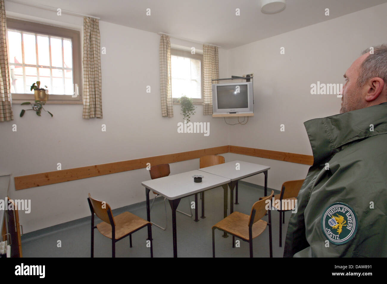 A prison officer shows the photographer the female wing's common room ...