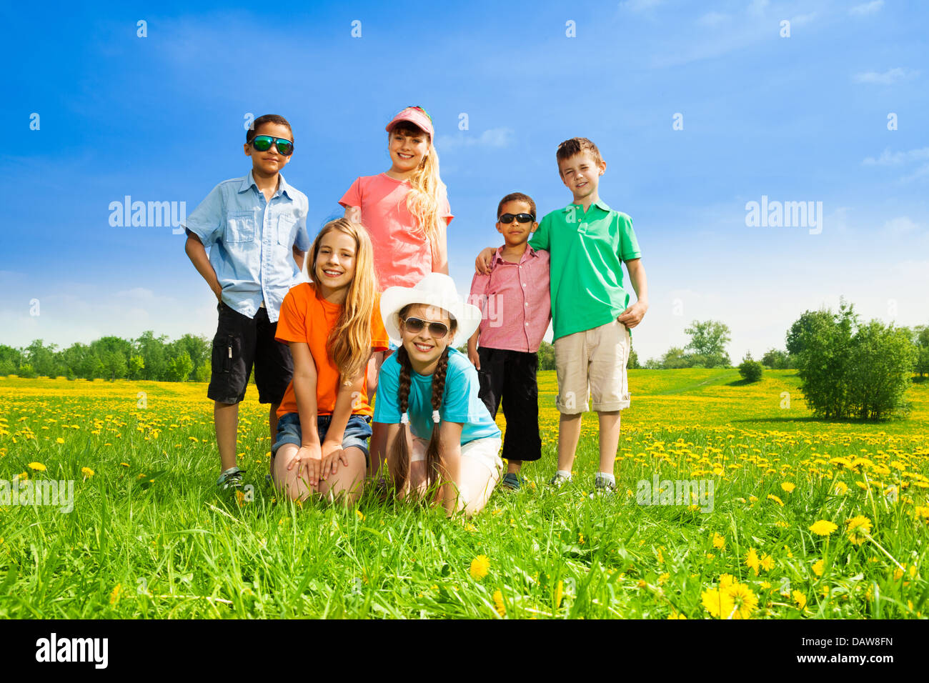 Group of happy diversity looking kids, boys and girls standing in the ...