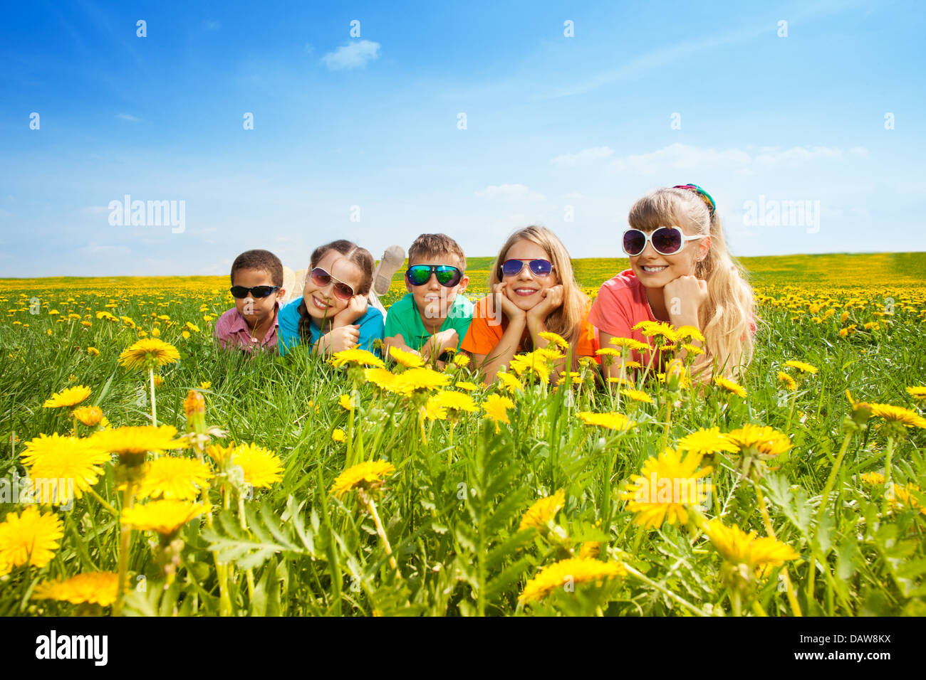 Group happy kids laying in hi-res stock photography and images - Alamy
