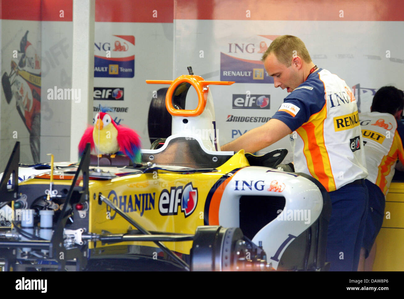 Mechanics of the Renault F1 team prepare a racing car for the Formula 1 ...