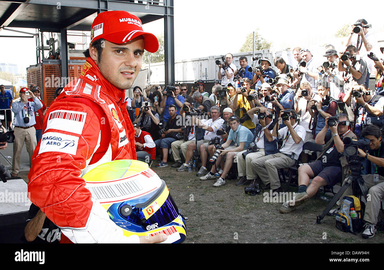 Brazilian Formula One pilot Felipe Massa (L) of Scuderia Ferrari poses ...