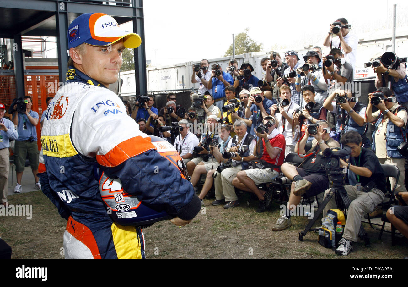 Finnish Formula One rookie Heikki Kovalainen (L) of Renault F1 poses ...