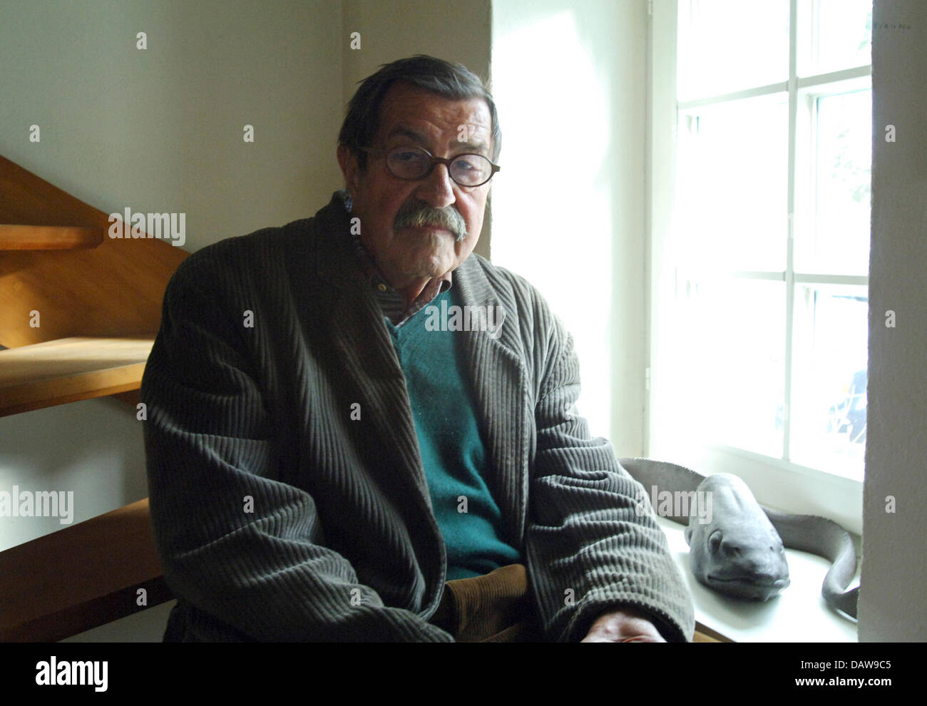 Laureate of the Nobel Prize in Literature Guenter Grass sits near a ...