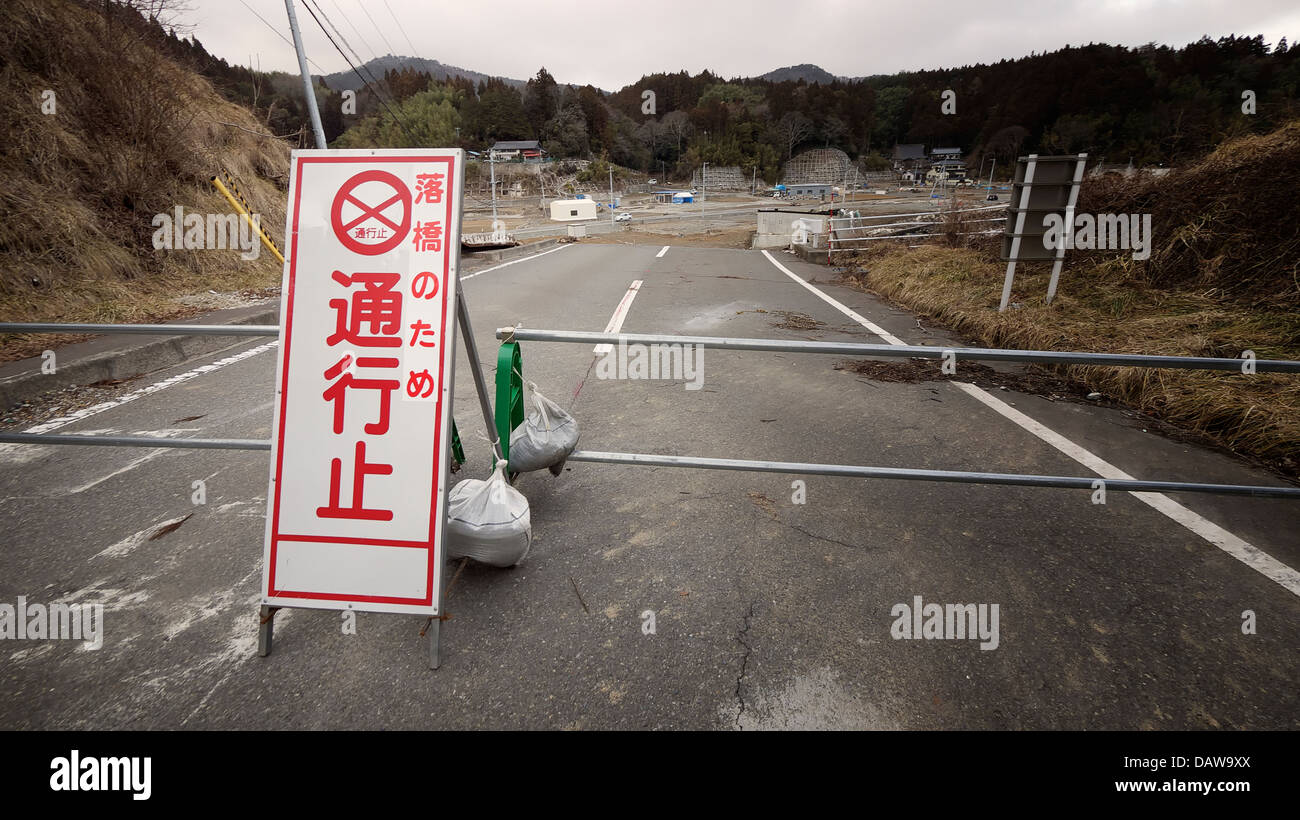 No entry sign before a collapsed bridge at the badly damaged and ...
