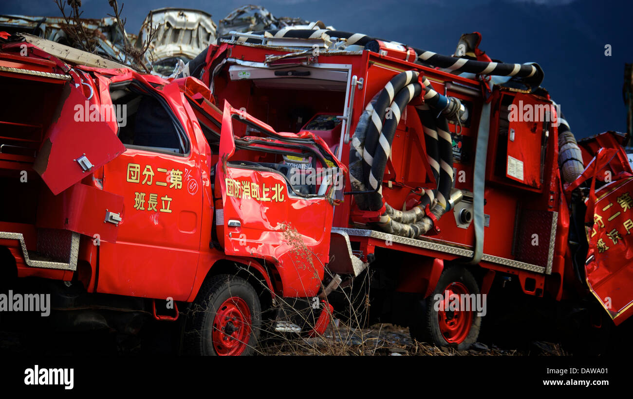 Totally wrecked fire engines at the badly damaged and leveled Onagawa 1 ...