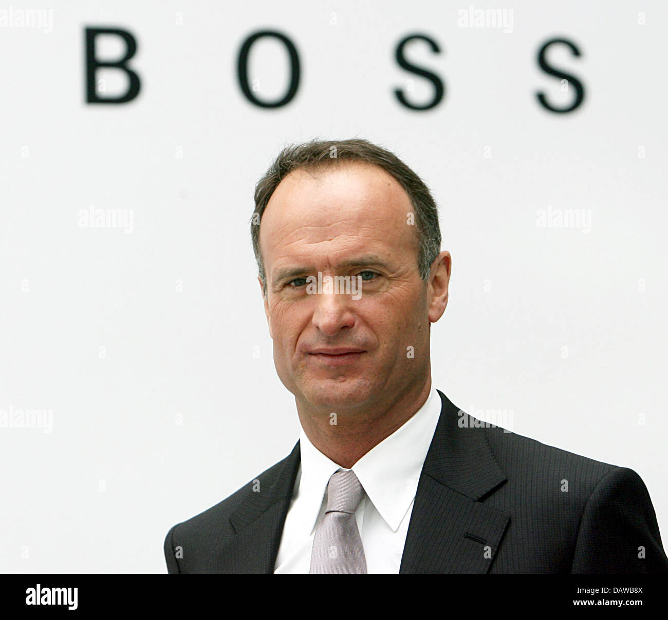 Hugo Boss CEO Bruno Saelzer is pictured in front of a Boss logotype ...