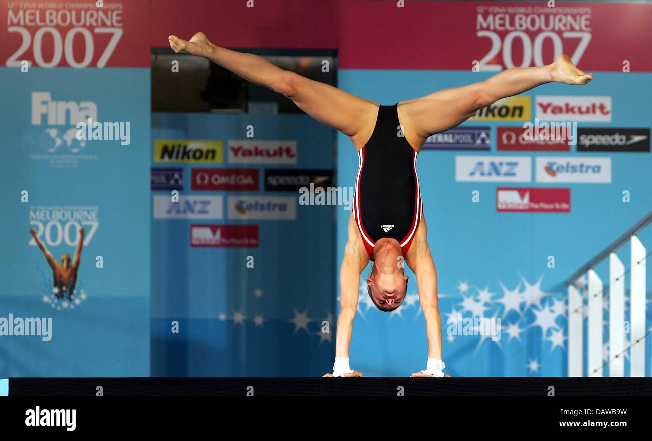 German diver Christin Steuer does a handstand and spreads her legs ...