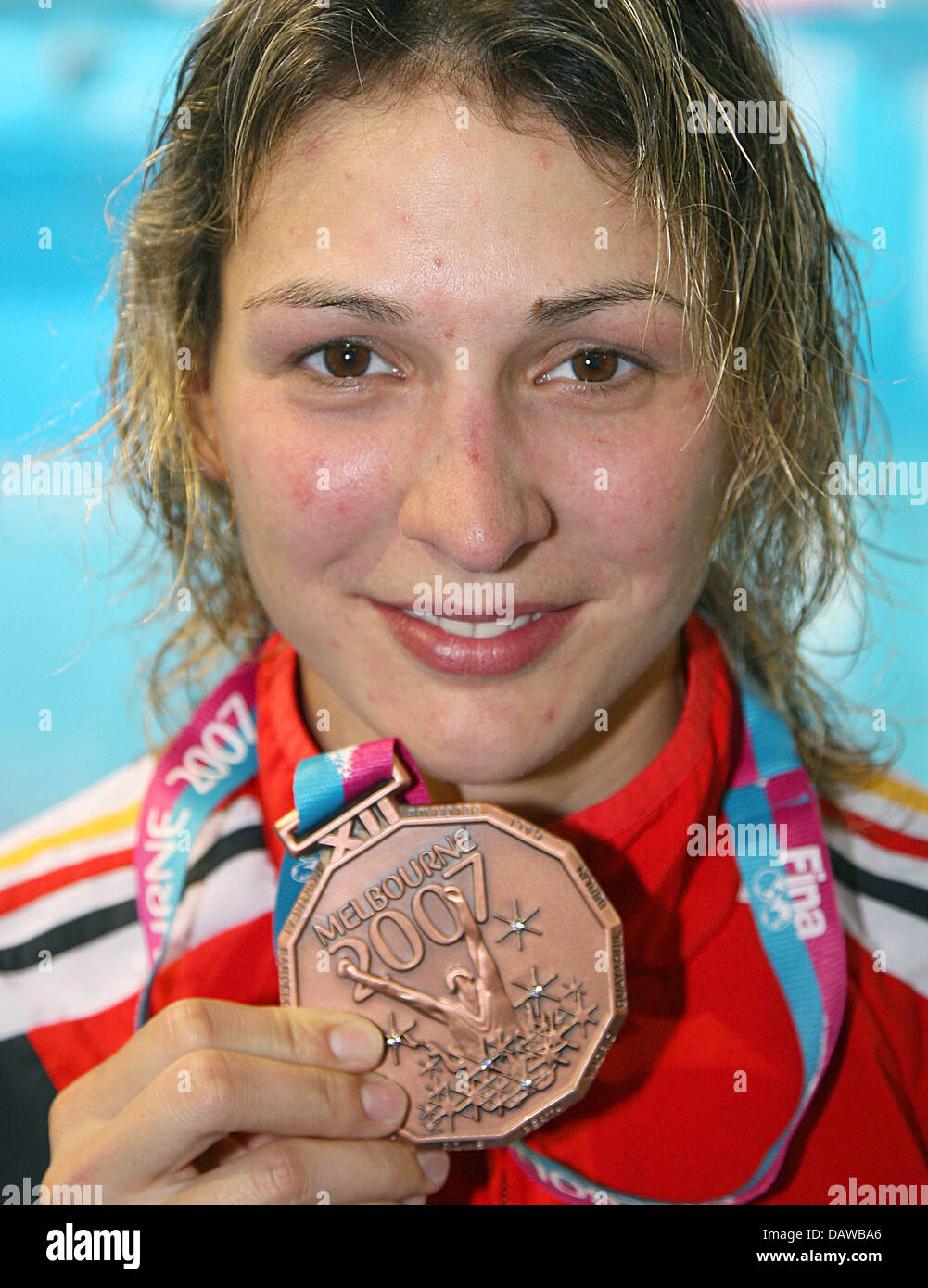 German diver Christin Steuer poses with her bronze medal after the ...
