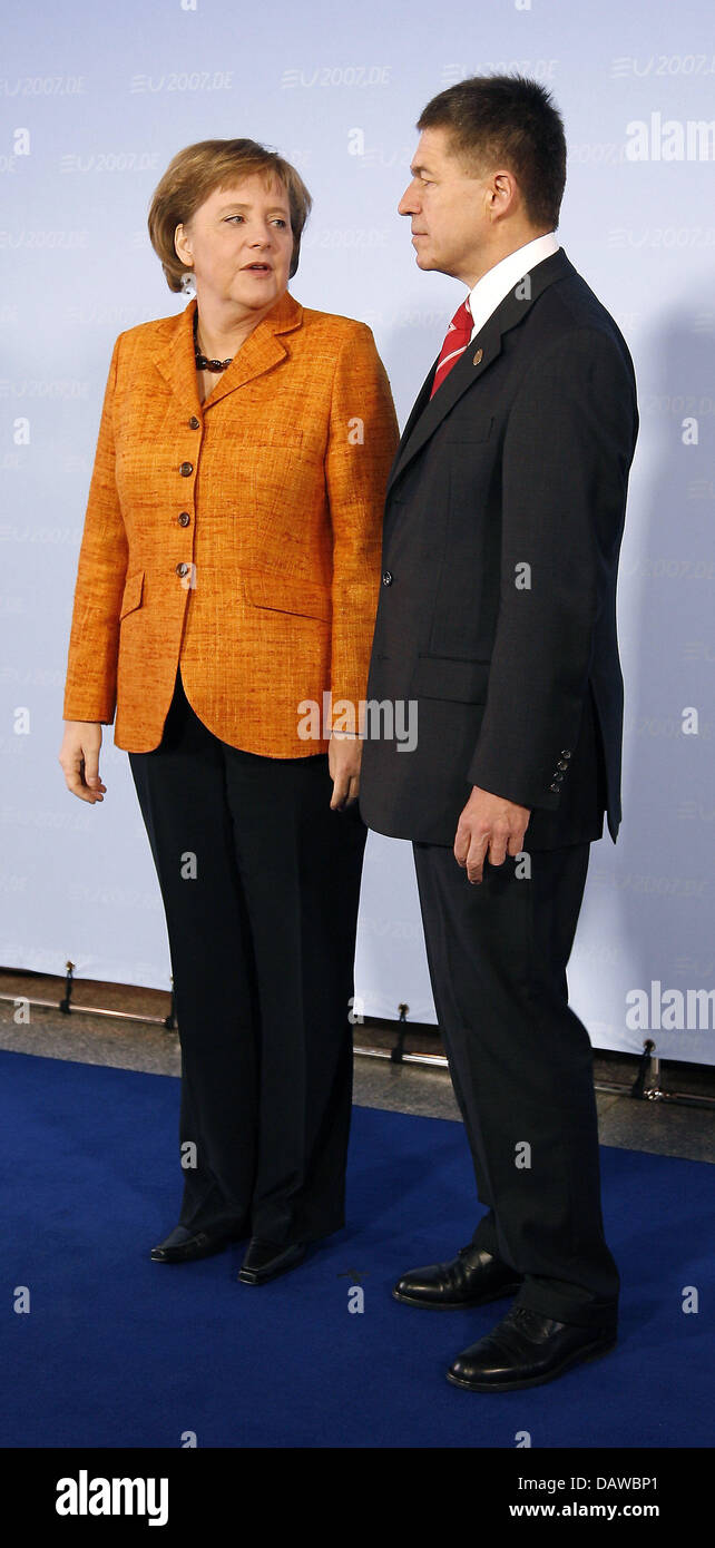 German Chancellor Angela Merkel and her husband Joachim Sauer are ...