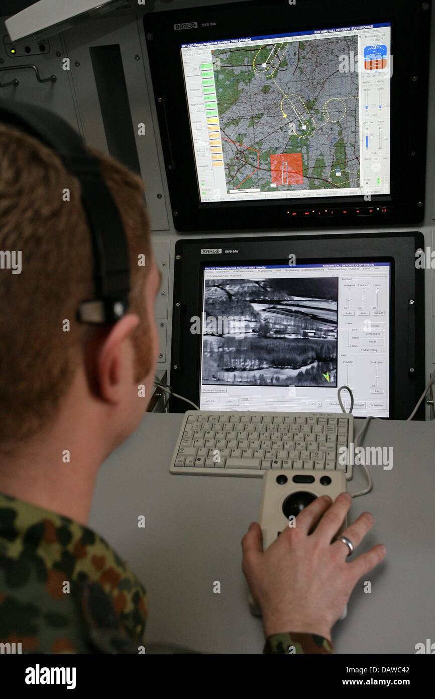 A German Bundeswehr soldier surveys the flight of a new reconnaissance ...