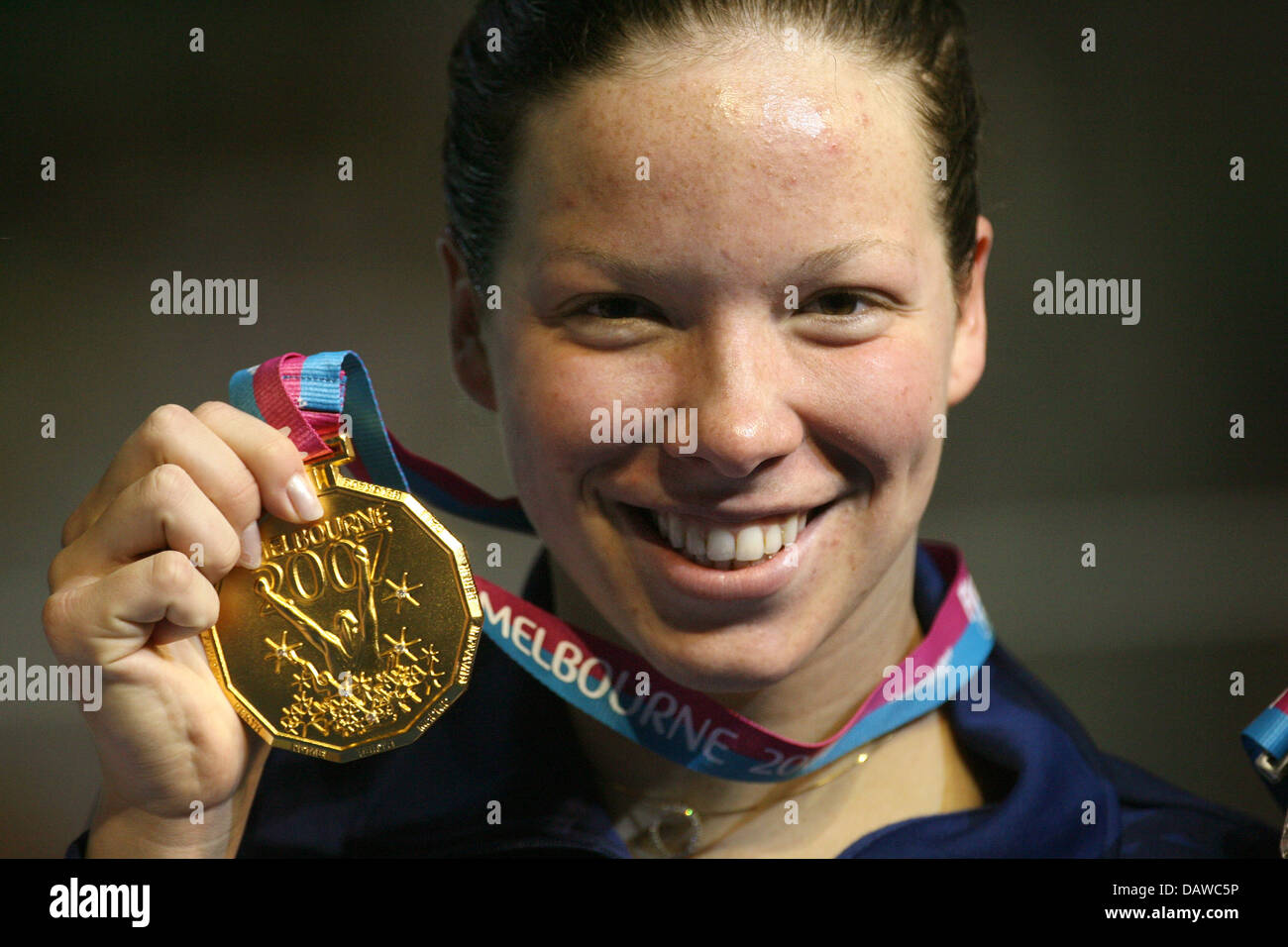 US swimmer Kate Ziegler presents her gold medal won at the Women's ...