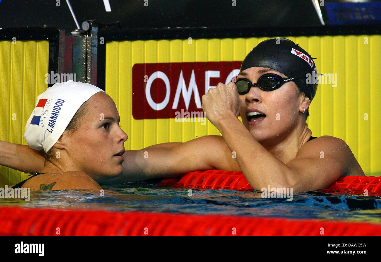 US swimmer Natalie Coughlin (R) cheers winning ahead of French Laure ...