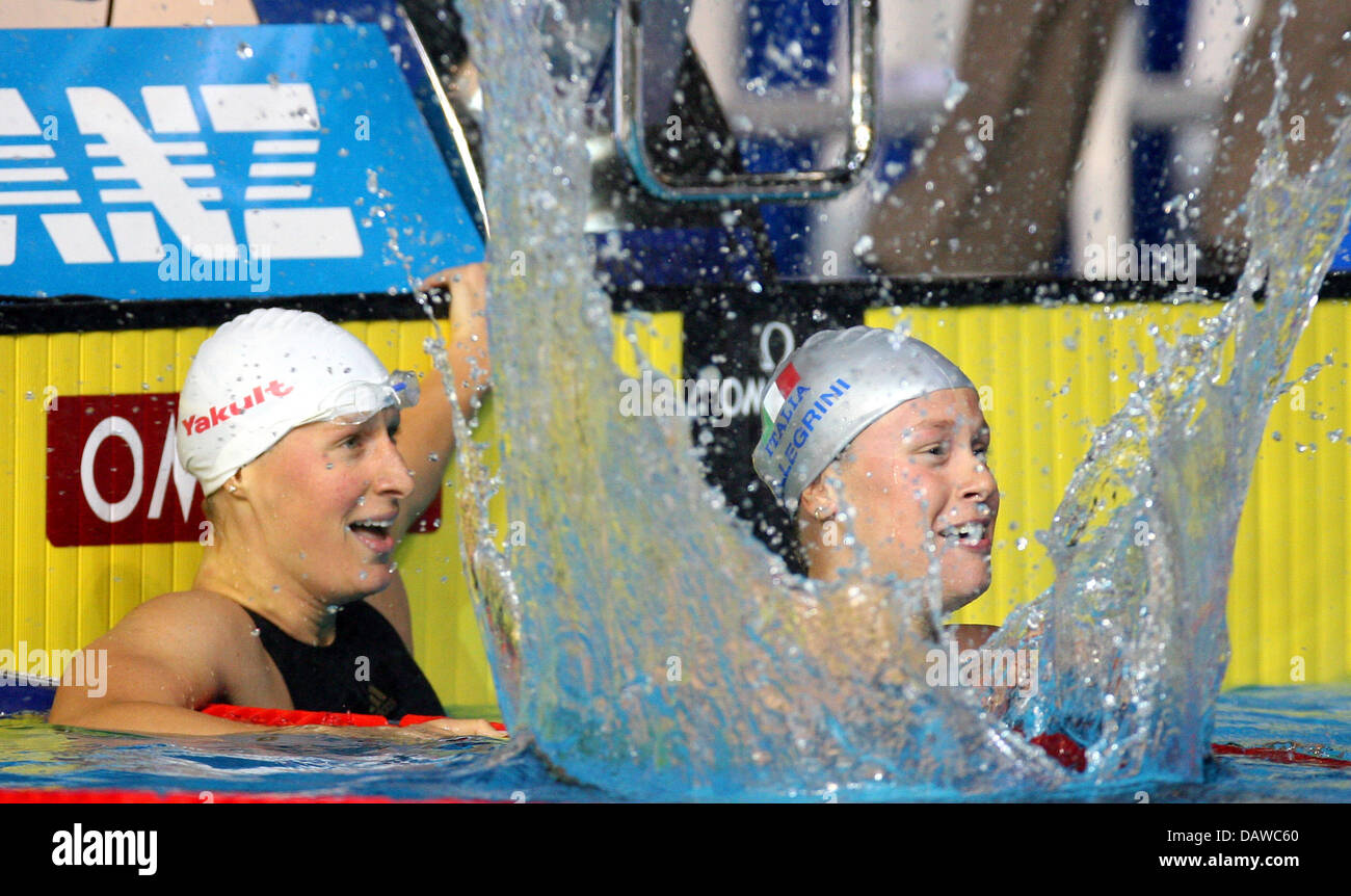Italian swimmer Federica Pellegrini (R) celebrates her victory in world ...