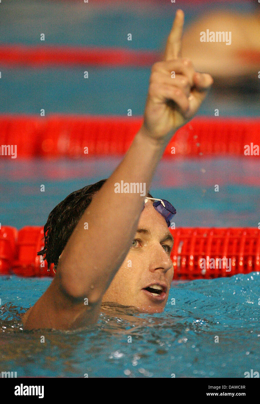 US swimmer Aaron Peirsol cheers winning the Men's 100m Backstroke of ...