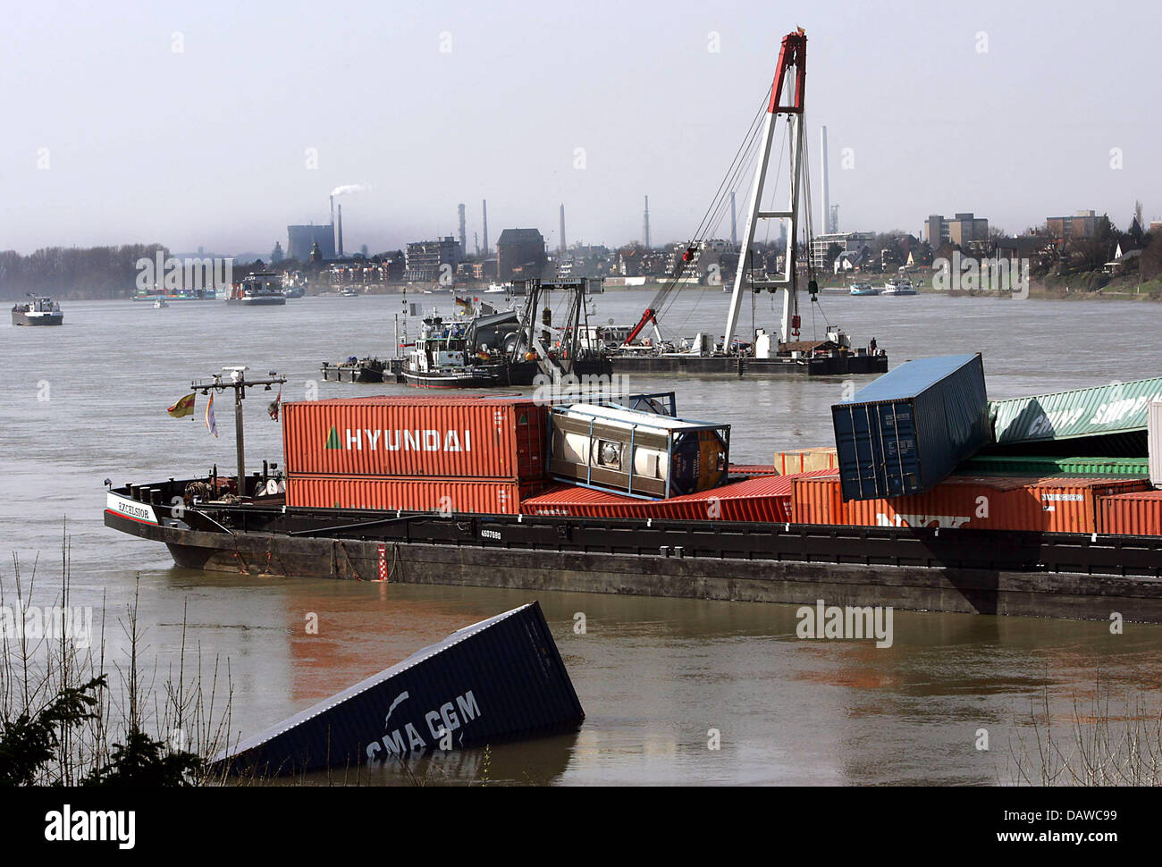 The recovery of sunken containers by a crane ship is prepared behind ...