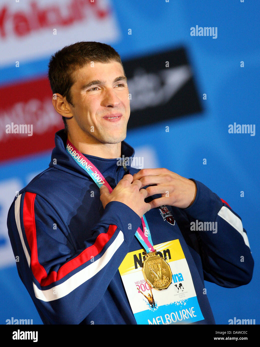 US-American swimmer Michael Phelps shows his medal after winning the ...