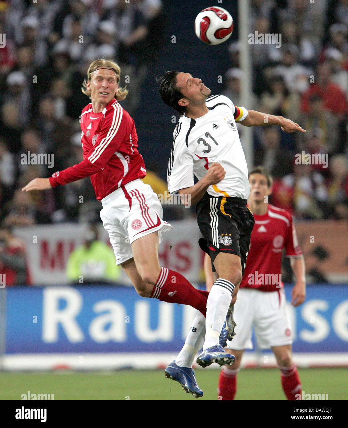 German national team player Kevin Kuranyi (C) vies with Denmark's ...