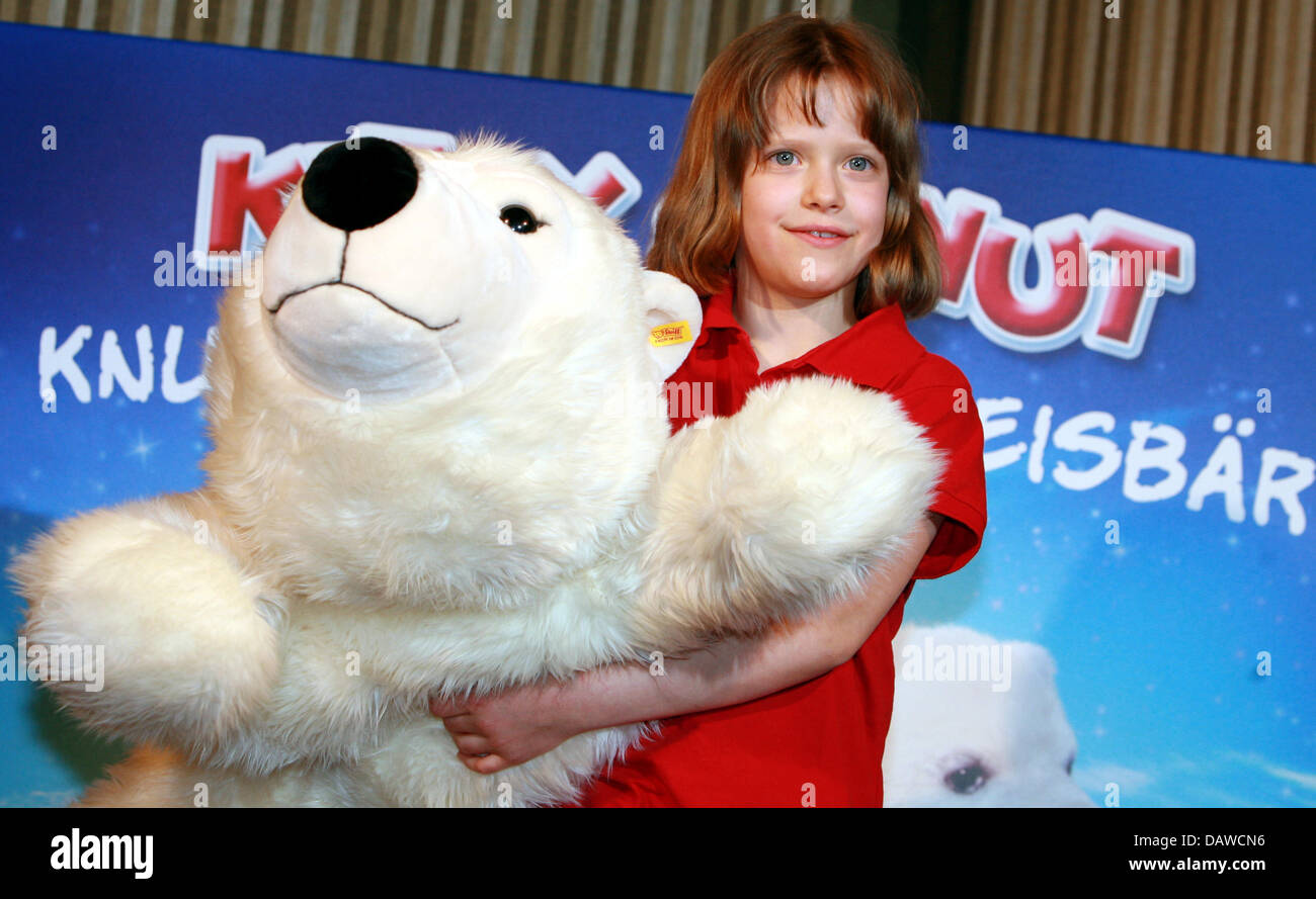 Nine-year-old Kitty poses with plush toy Knut at a sound studio in ...