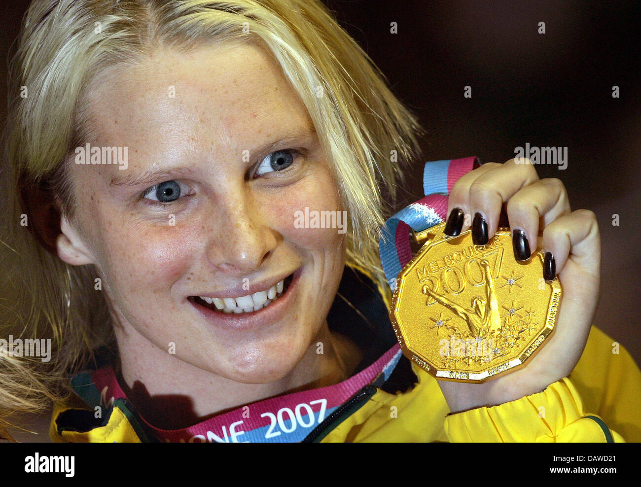 Australian swimmer Leisel Jones smile with her gold medal for the Women ...