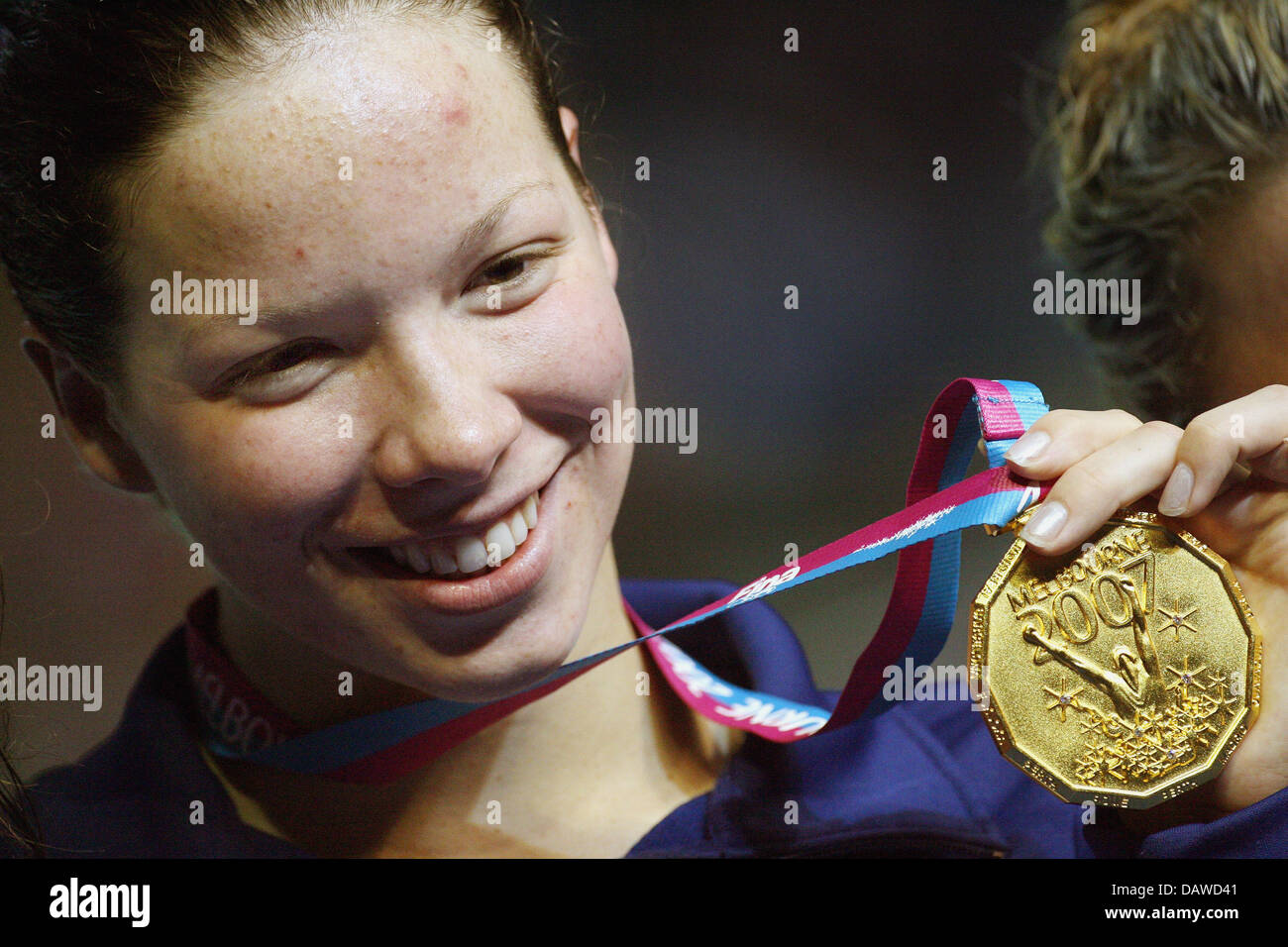 US swimmer Kate Ziegler shows her gold medal for the Women's 800m ...