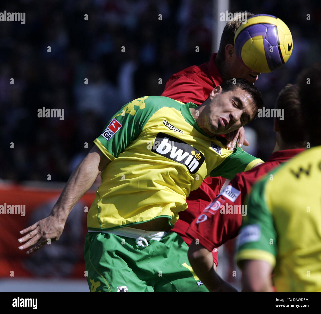 Munich's player Berkant Goektan (front) and Essen's Martin Hysky shown ...