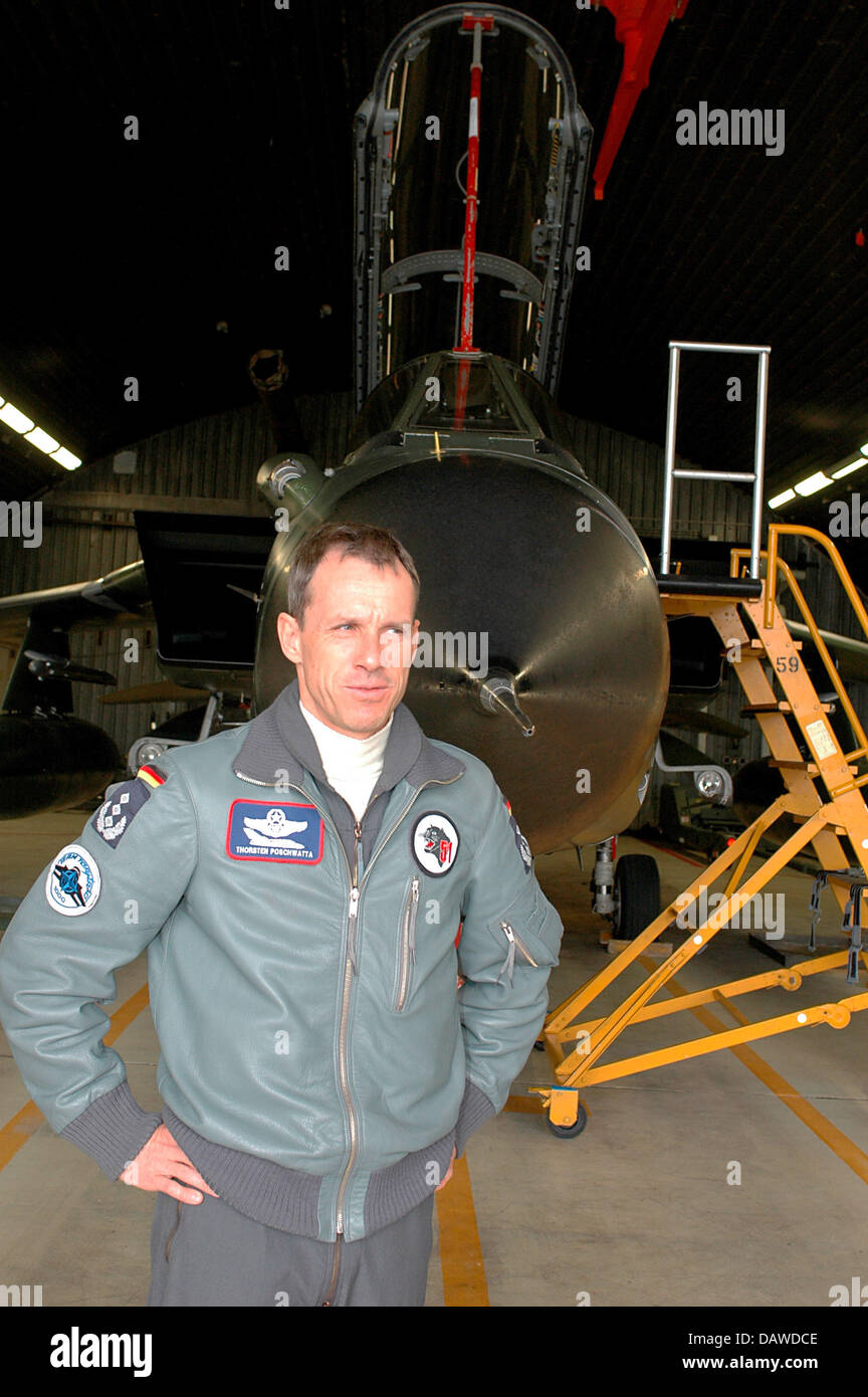 Colonel Thorsten Poschwatta stands in front of a Tornado surveillance ...