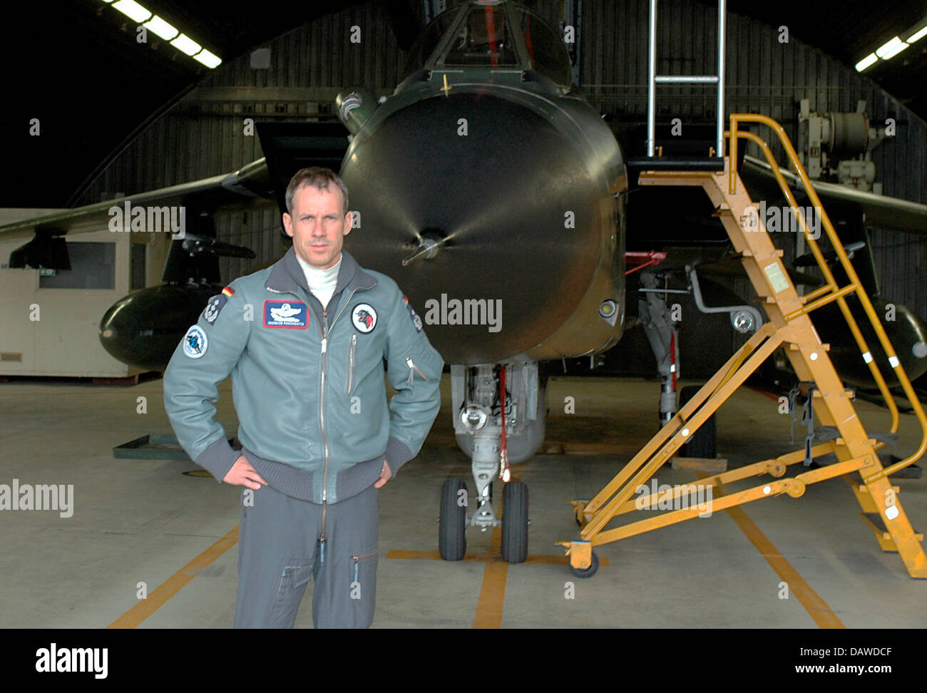 Colonel Thorsten Poschwatta stands in front of a Tornado surveillance ...