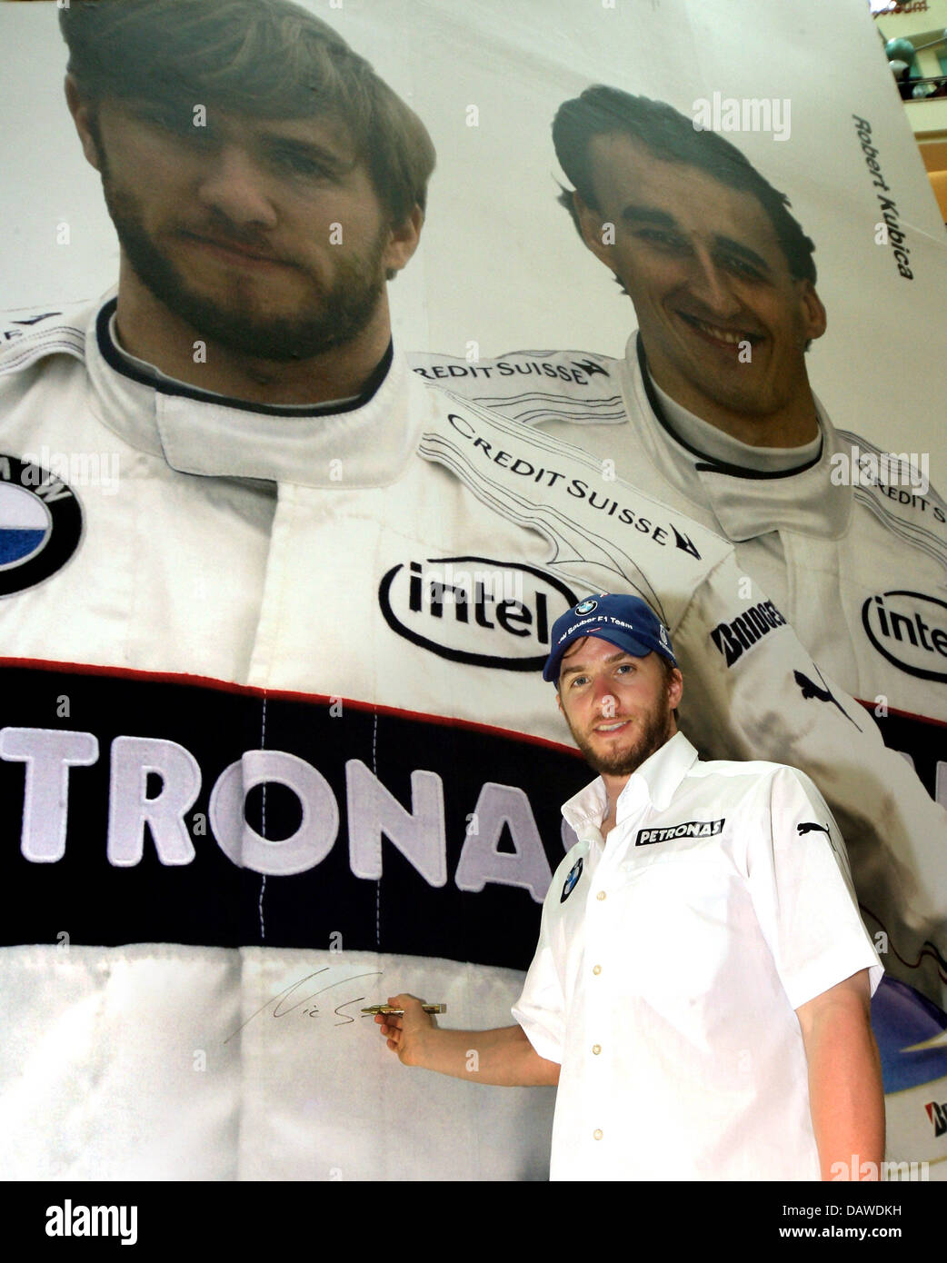 German Formula One pilot Nick Heidfeld of BMW Sauber F1 signs a large ...