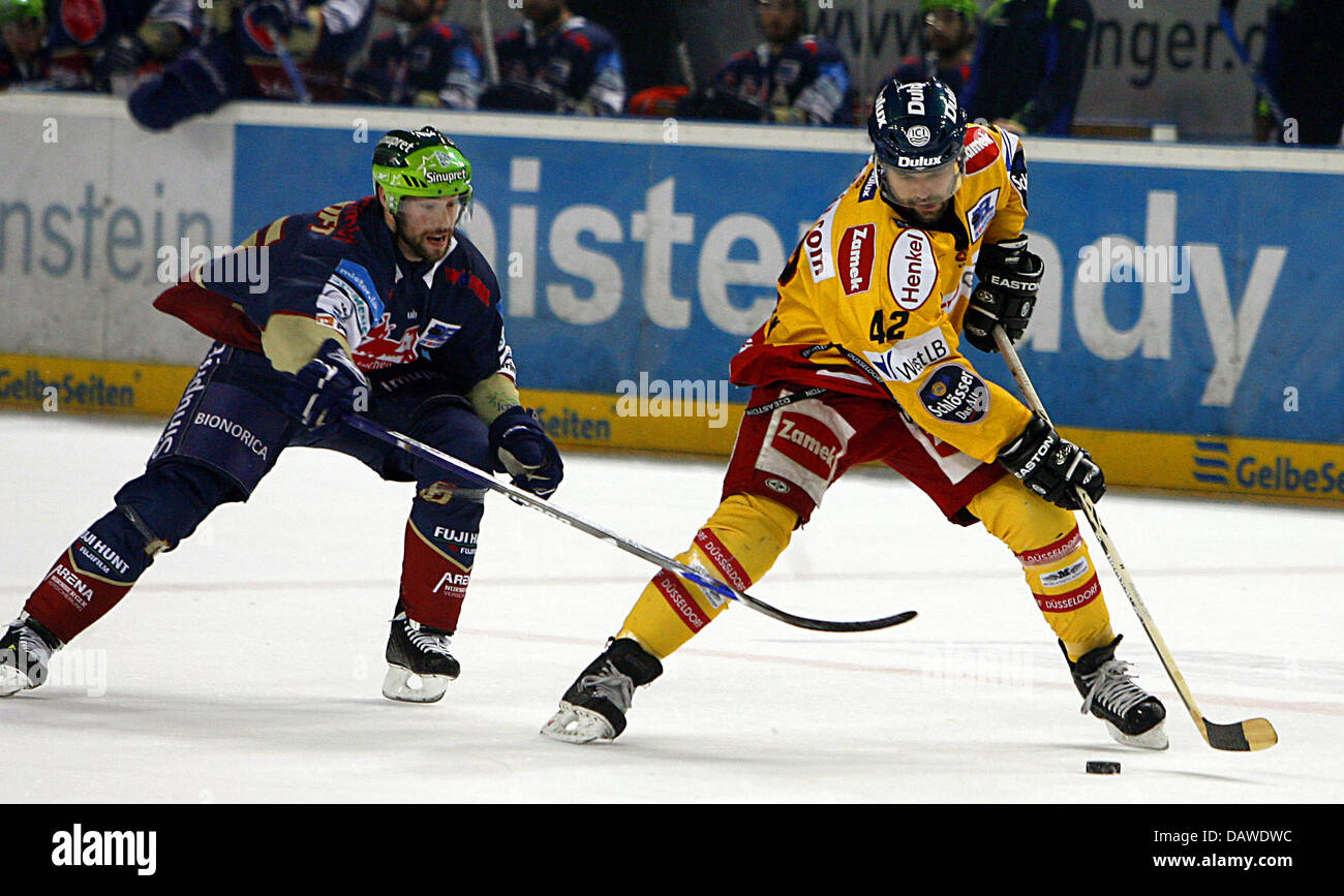 Nurembergs Justin Mapletoft (L) vies for the puck with Duesseldorf's ...