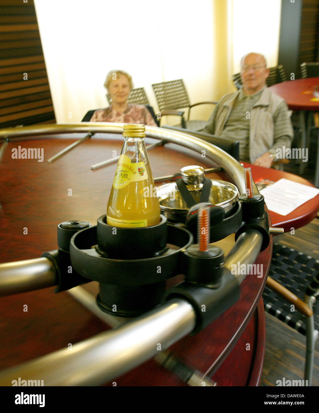 A track system serves customers their food and beverages at the ...