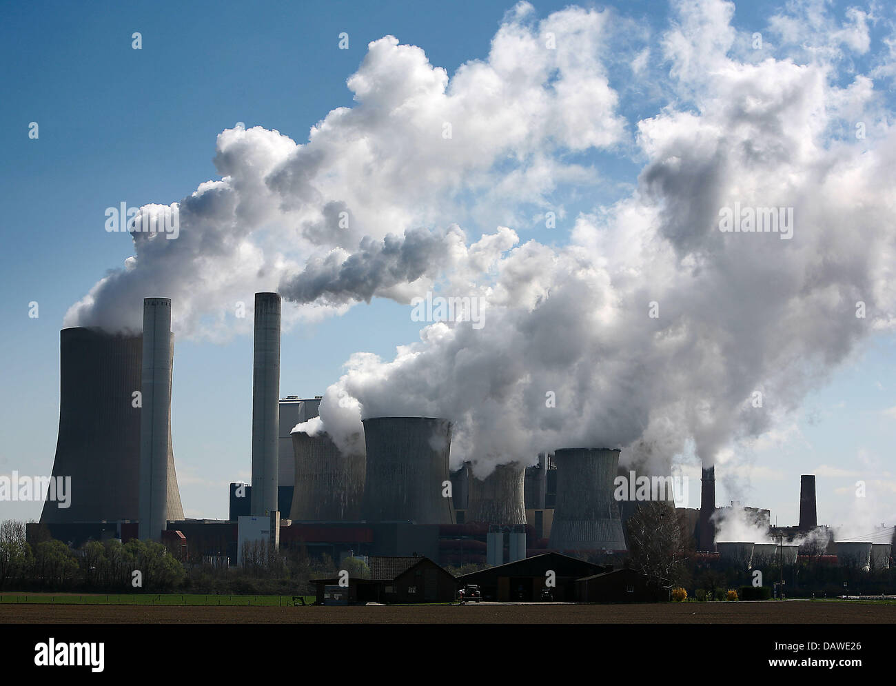 Smoke emerges from the cooling towers of the RWE brown coal-fired power ...