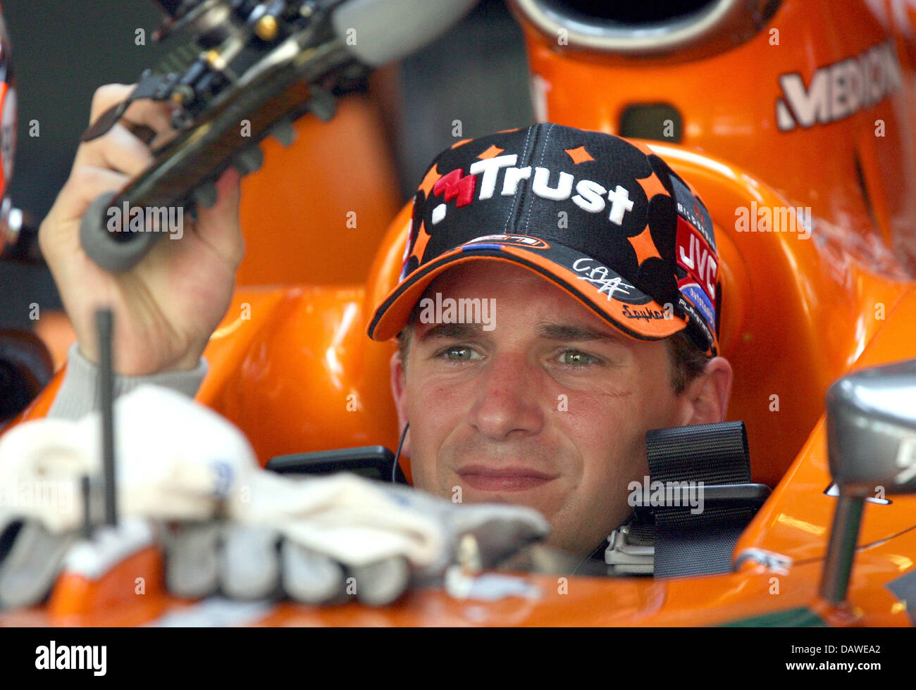 Dutch Formula One driver Christian Albers of Spyker holds the steering ...